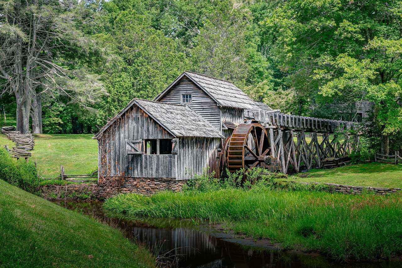 Rural scene with green trees and rustic building | Jigsaw King